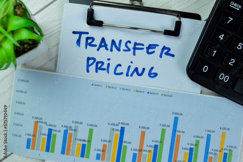 Concept of Transfer Pricing write on paperwork isolated on Wooden Table ...