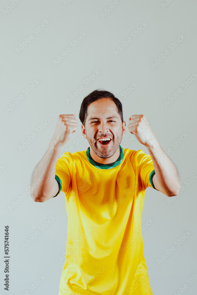 sports fan or soccer fan in yellow t-shirt with green borders ...