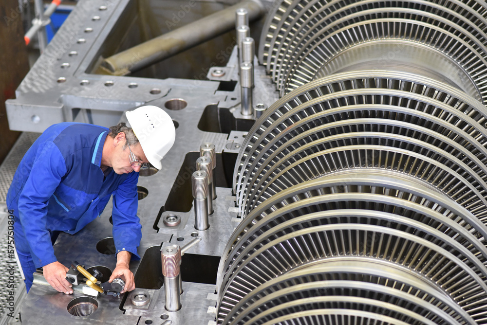 workers assembling and quality control of gas turbines in a modern ...