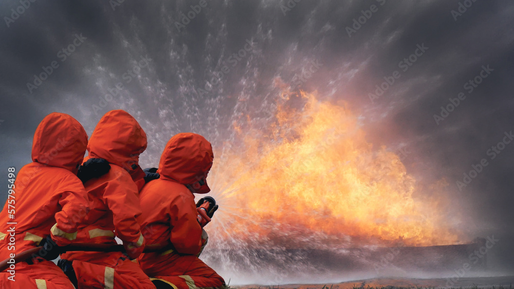 Firefighter Rescue team training in fire fighting extinguisher ...