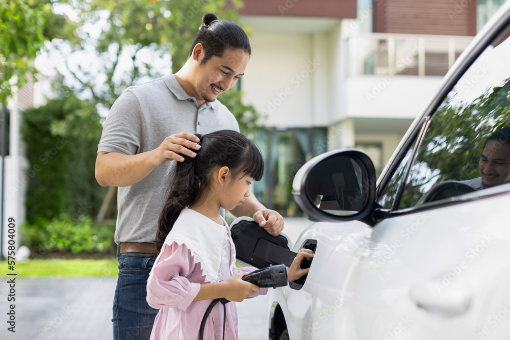 Progressive father and daughter returned from school in electric ...