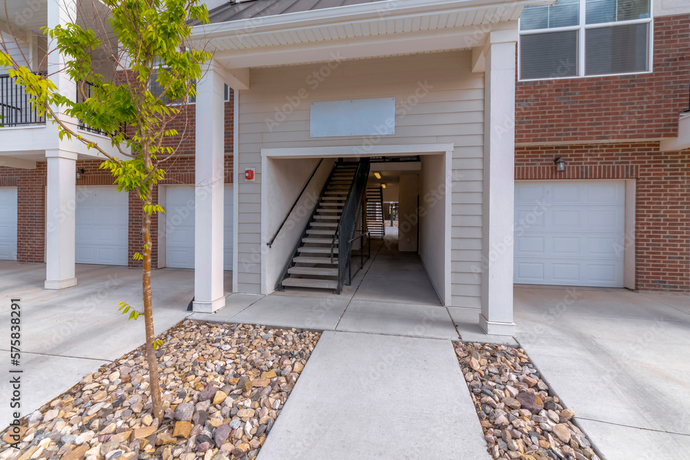 Apartment exterior with bricks and painted wood lap siding. Residential ...