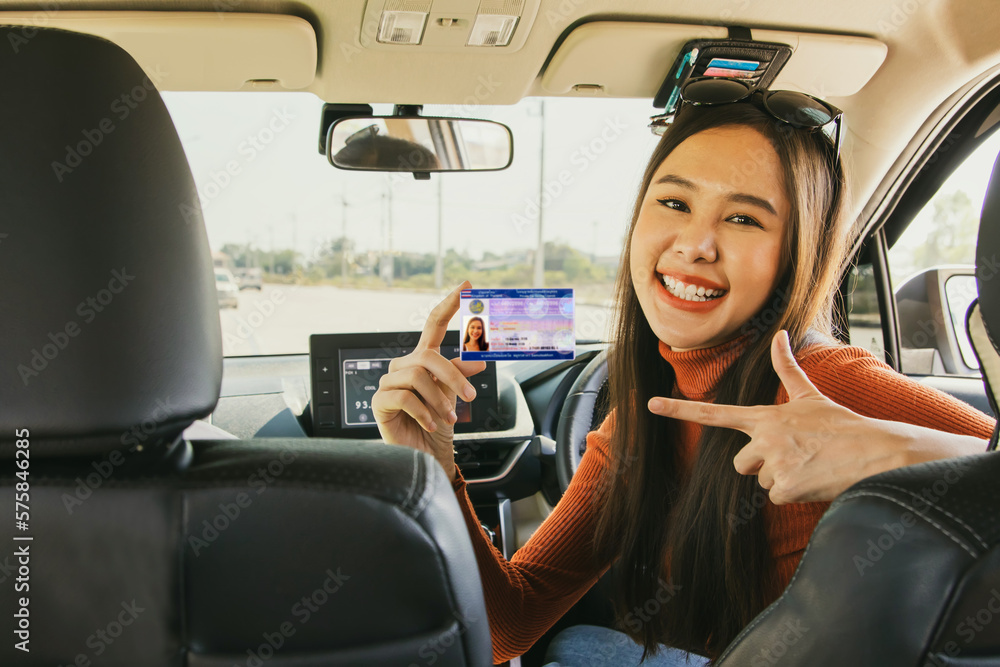 Portrait young asian woman sitting in her car show ownership of ...