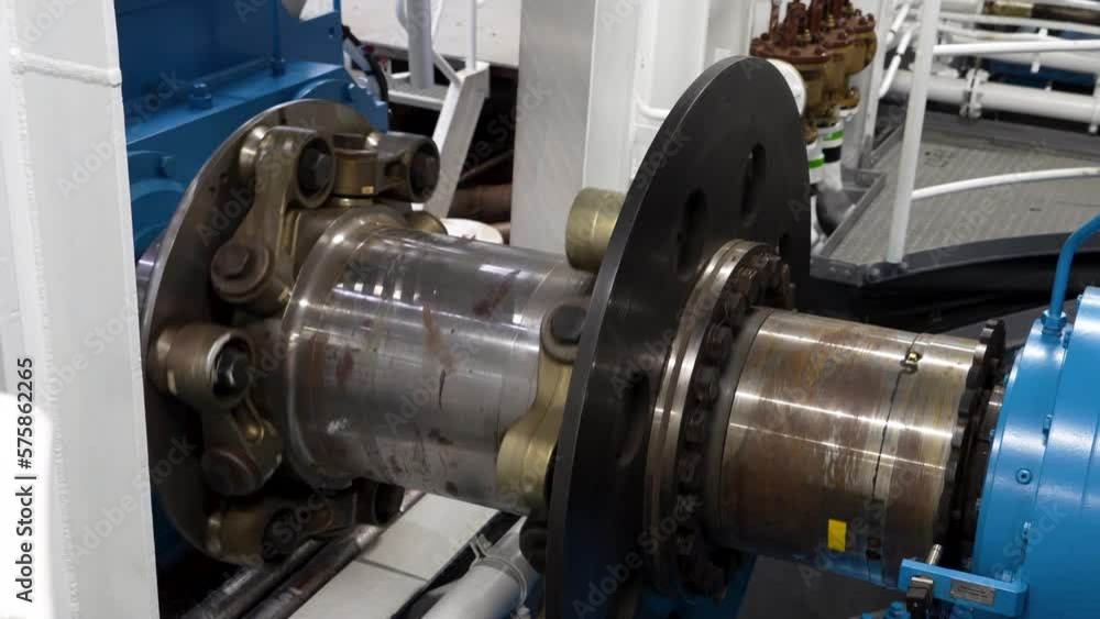 Main shaft rotates. Motor room of vessel inside. Shaft from engine to ...