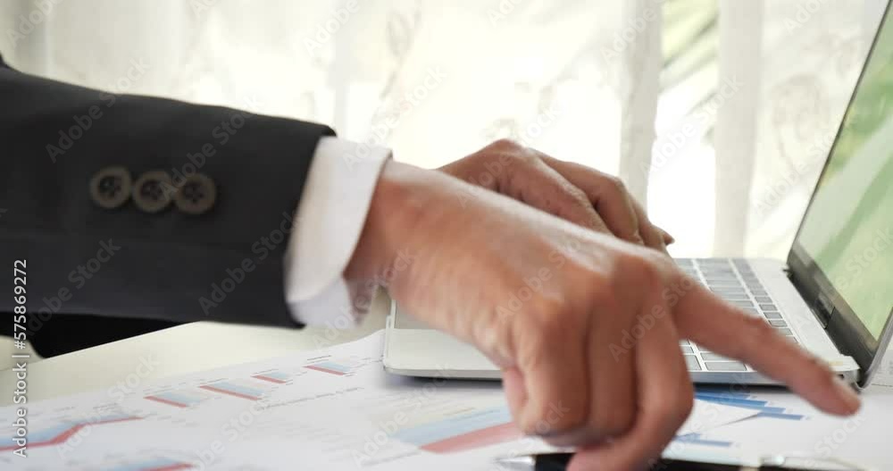 Closeup businessman hands working use laptop finance business document ...