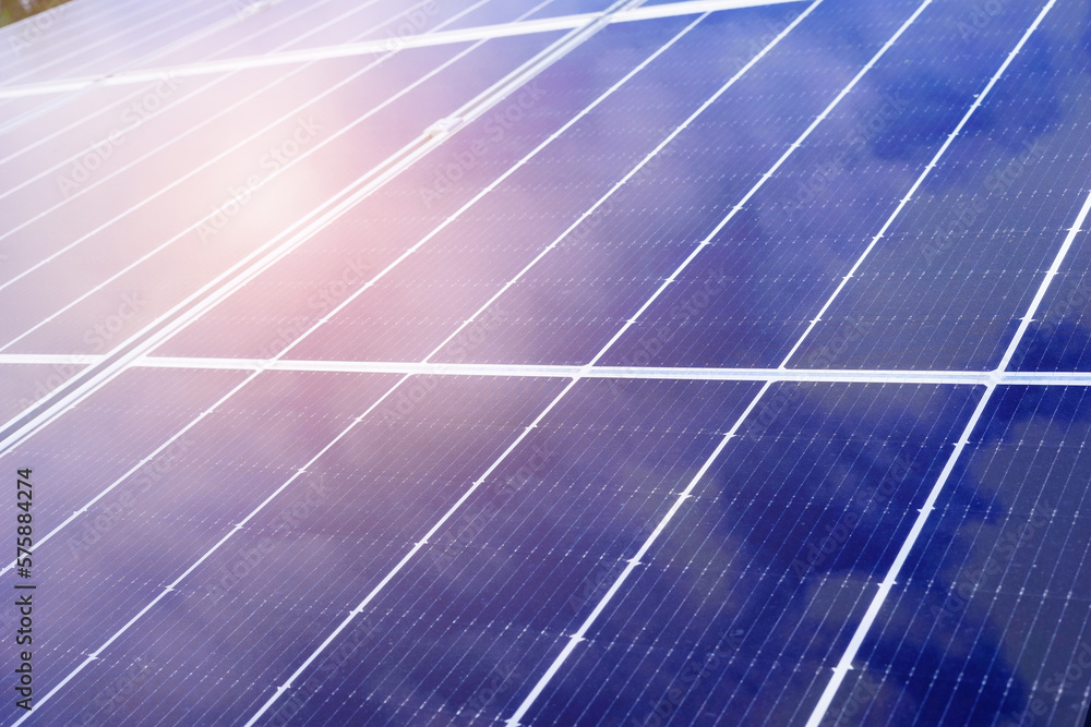 Close up of blue solar panel with Sunlight ray and cloud reflection ...