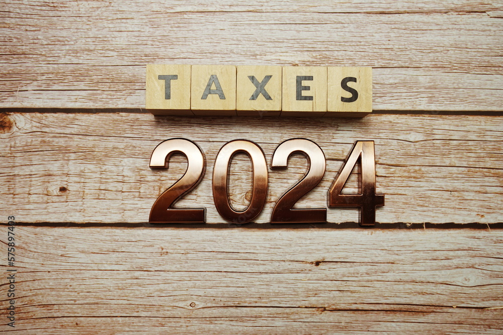 Taxes 2024 alphabet letter on wooden background Stock Photo | Adobe Stock