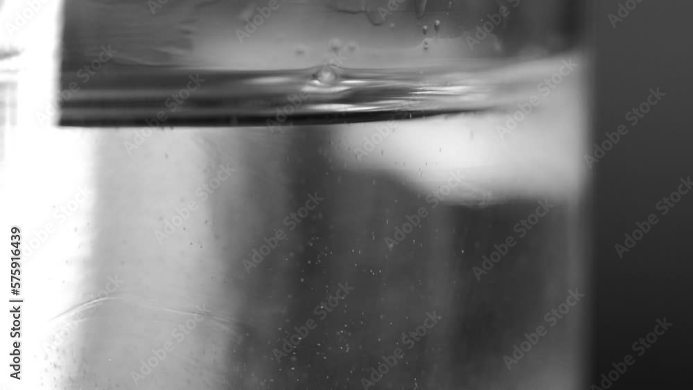 Water bubbles sparkling effect. White, transparent crystal clear glass with sparkling water ...