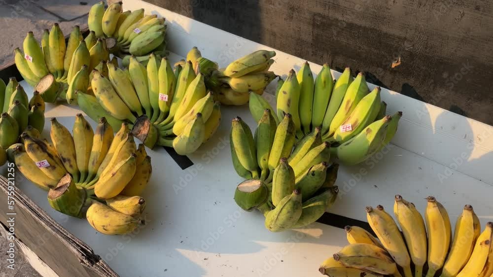 Bunch of bananas for sale at local store shelf first person point of ...