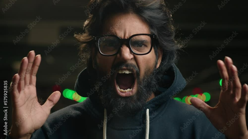Male portrait at dark parking lot irritated emotional angry Indian ...