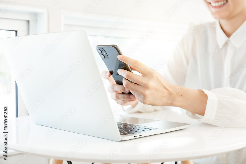 woman work using texting cell phone typing computer.student study ...