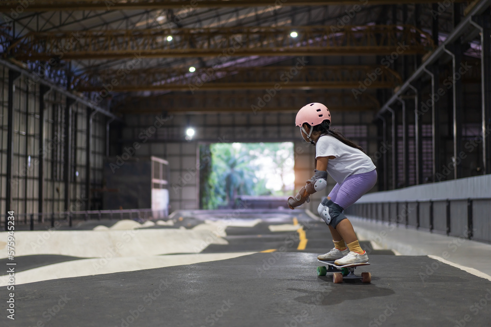 asian child skater or kid girl fun playing skateboard or start ride ...