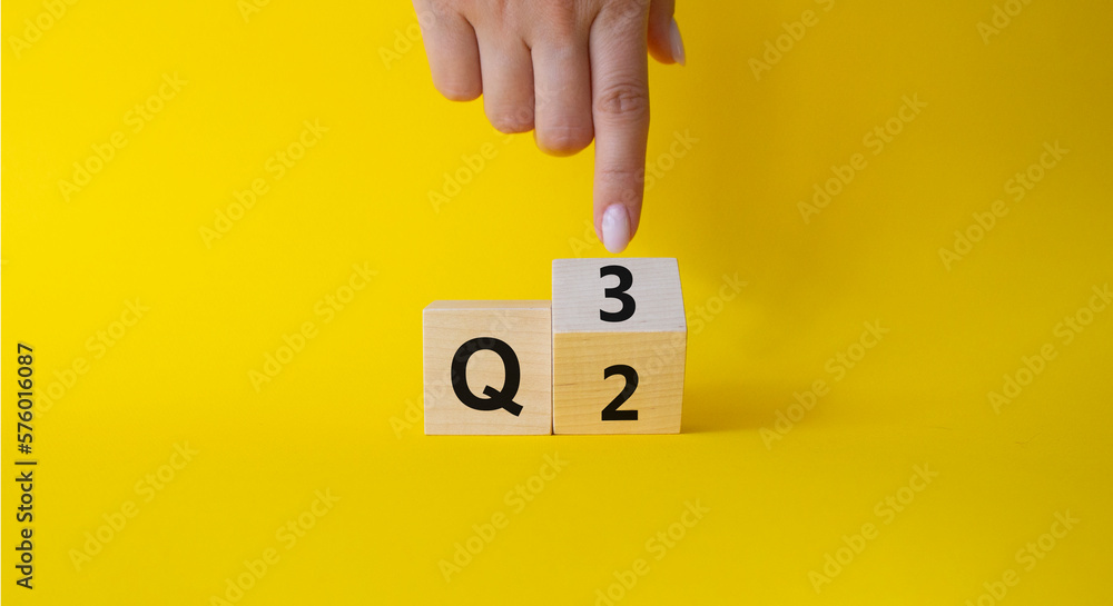 From 2nd Quarter to 3rd symbol. Businessman hand points at turned ...