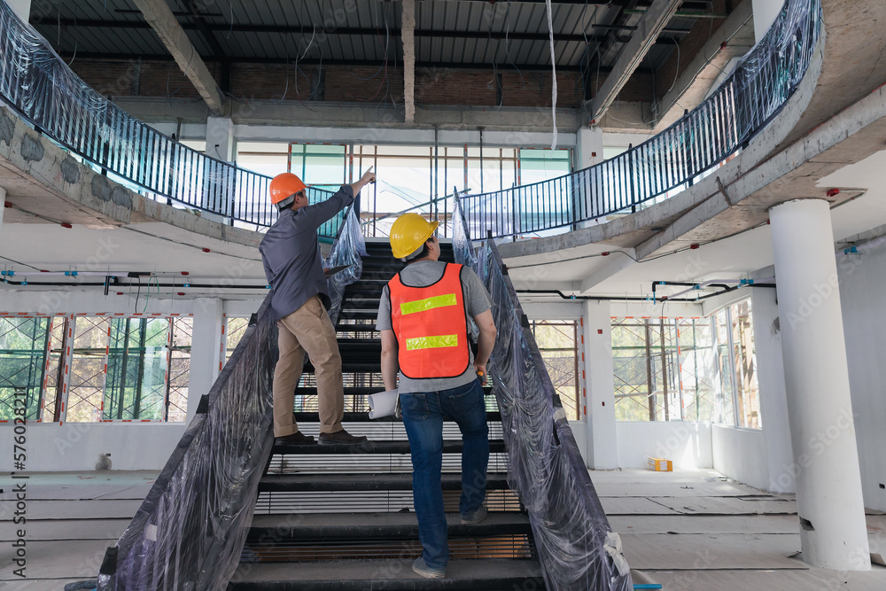 Engineer or Architect discussing with contractor about project on ...