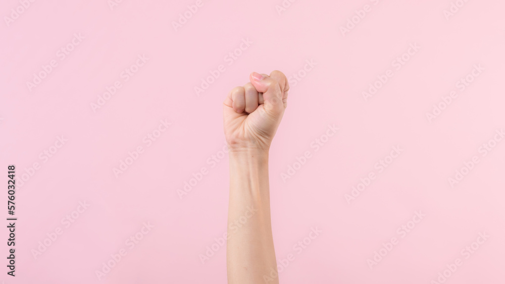 Woman fist fight for human rights and feminist with pink pastel ...