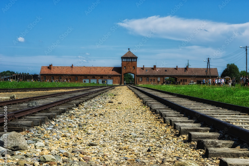 Famous entrance building of the concentration camp Birkenau with rails ...