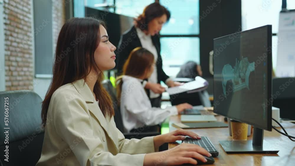 Female designer using computer to design ev car prototype at office ...
