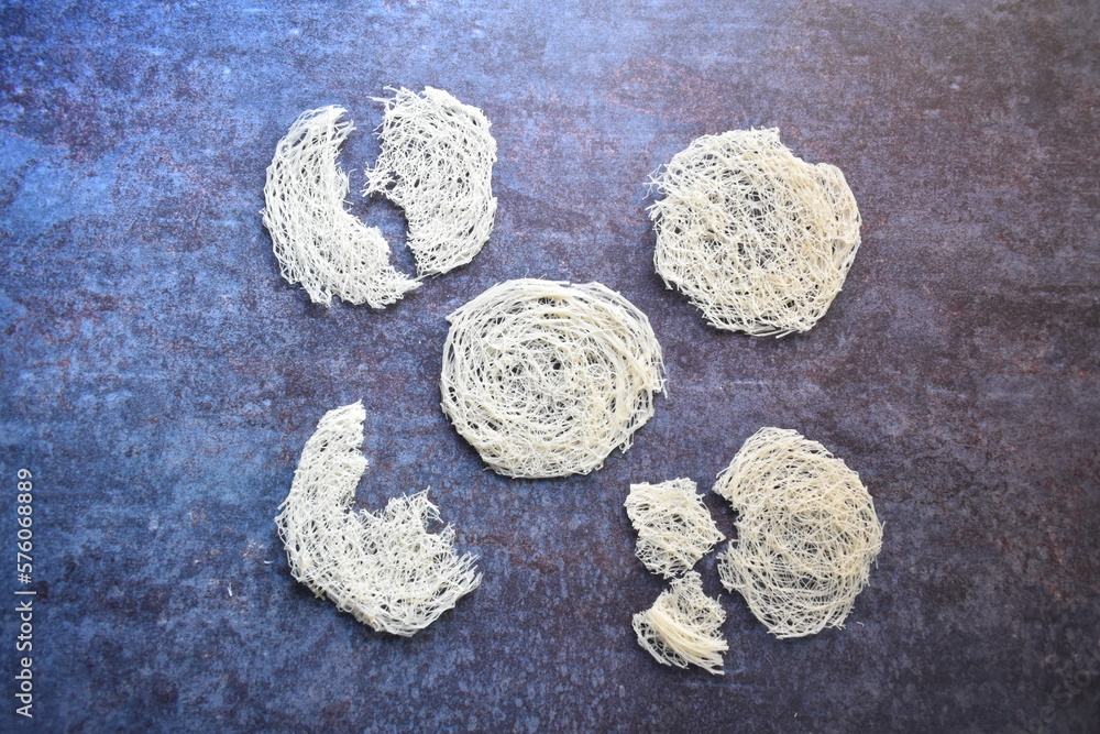 Raw whole dried round string hopper rice noodles Stock Photo | Adobe Stock