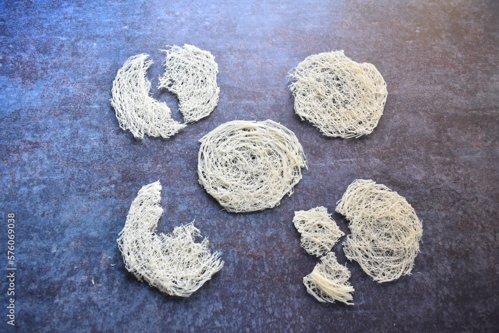 Raw whole dried round string hopper rice noodles Stock Photo | Adobe Stock