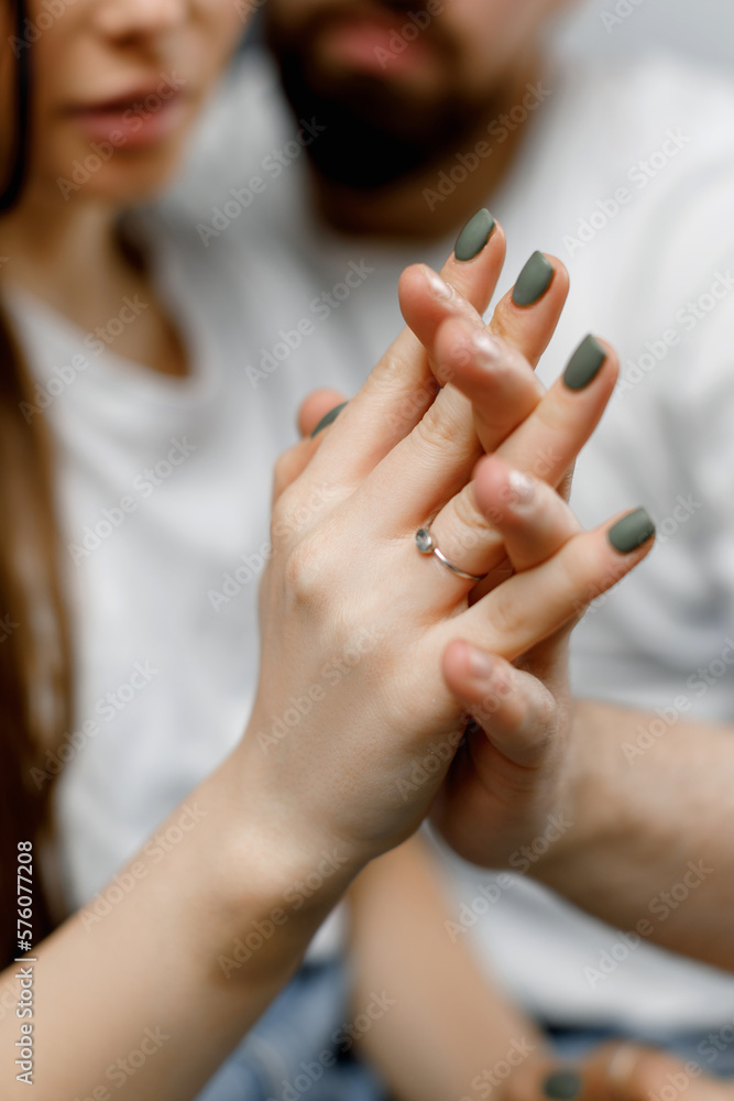 Couple in love are holding hand with interlocked fingers. Hands ...