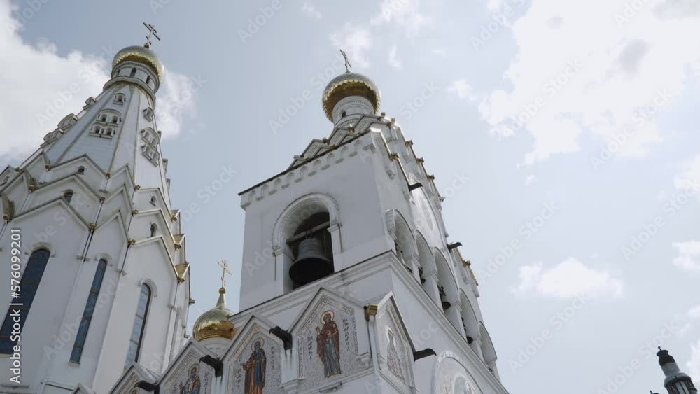 Beautiful white orthodox church with golden crosses, mosaics depicting ...