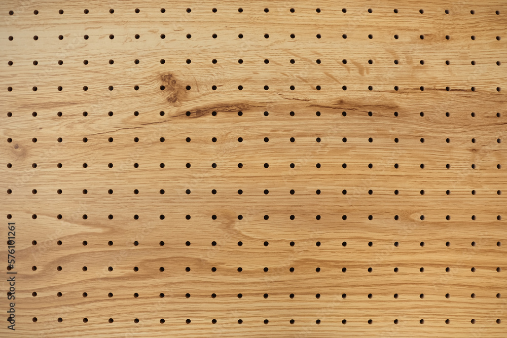 Perforated board background Stock Photo | Adobe Stock