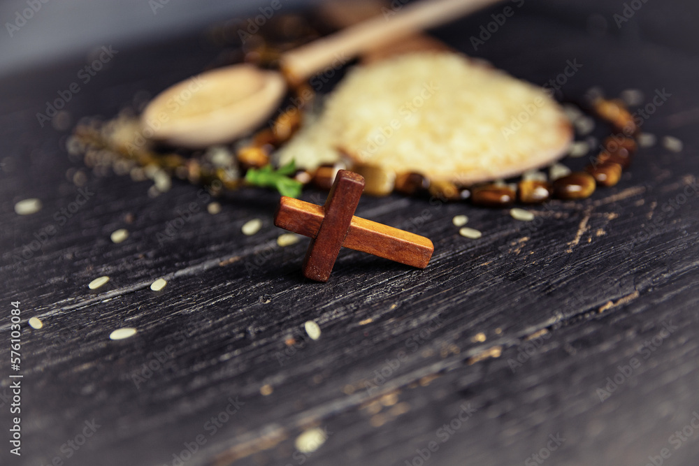 crucifix rosary and rice, Christian cross necklace on dark background ...
