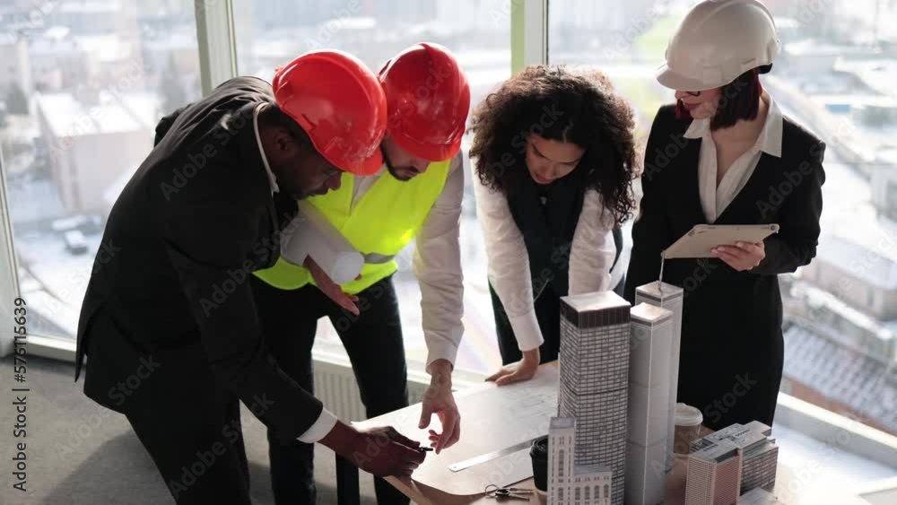 Qualified architects, engineers and designers having business meeting ...