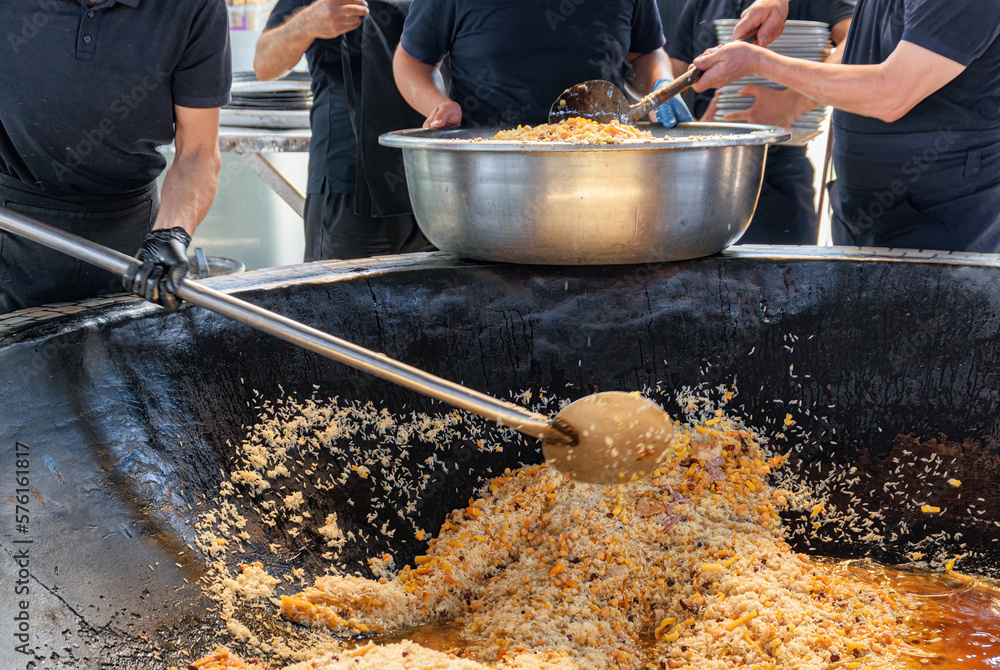 Uzbek plov is being prepared in giant kazan, Tashkent Stock Photo ...