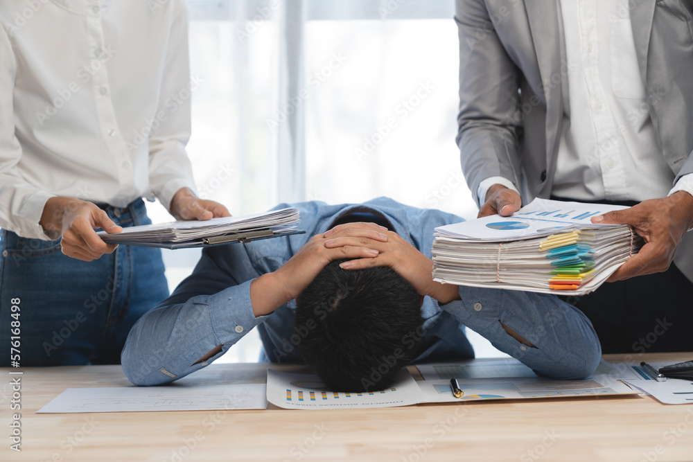 Tired Asian young businessman. Stressed. The man at work has a headache ...