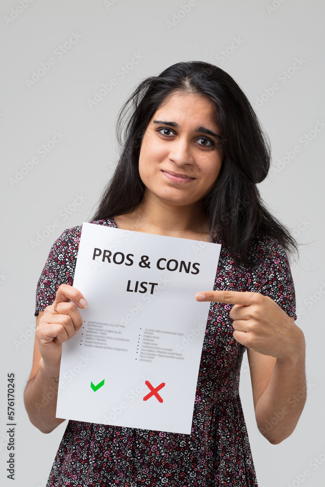 Indian woman weighs pros and cons Stock Photo | Adobe Stock
