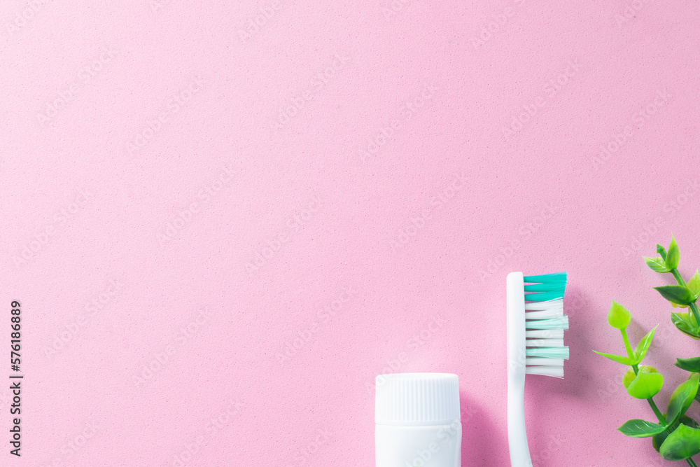 Pastel pink background with cleaning tools for oral and dental health ...