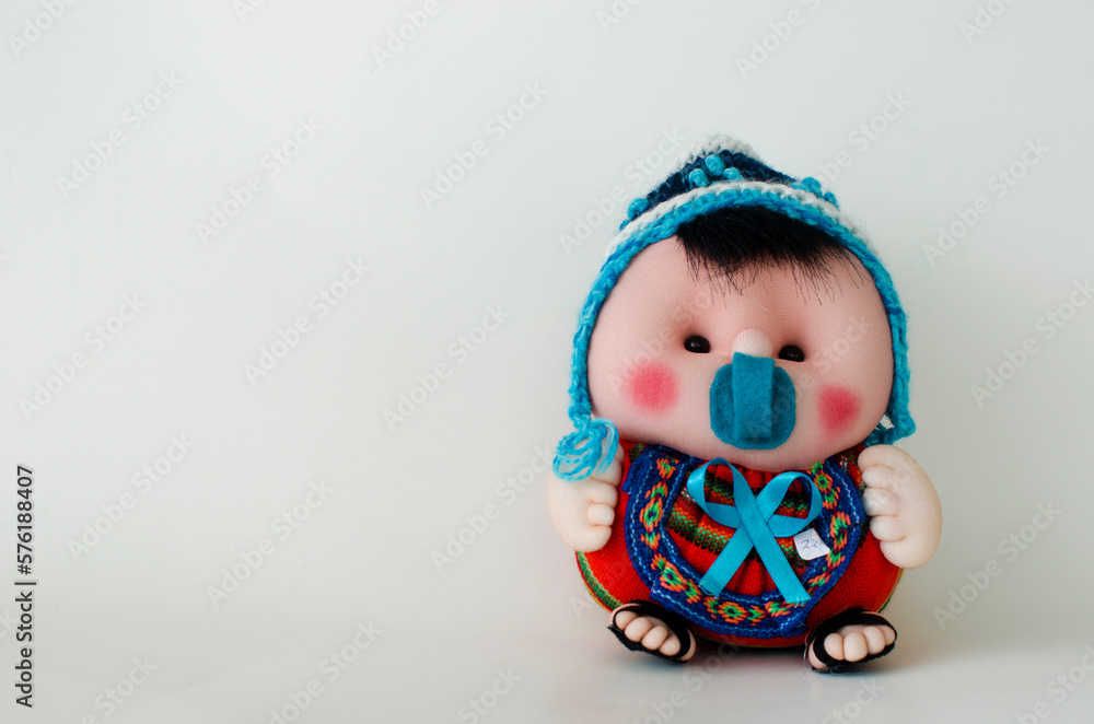Peruvian doll in white background. Baby boy with a pacifier wearing a ...