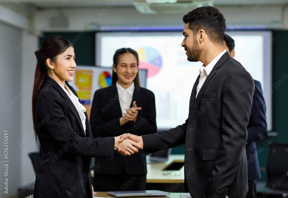 Millennial Asian Indian professional bearded male businessman shaking ...