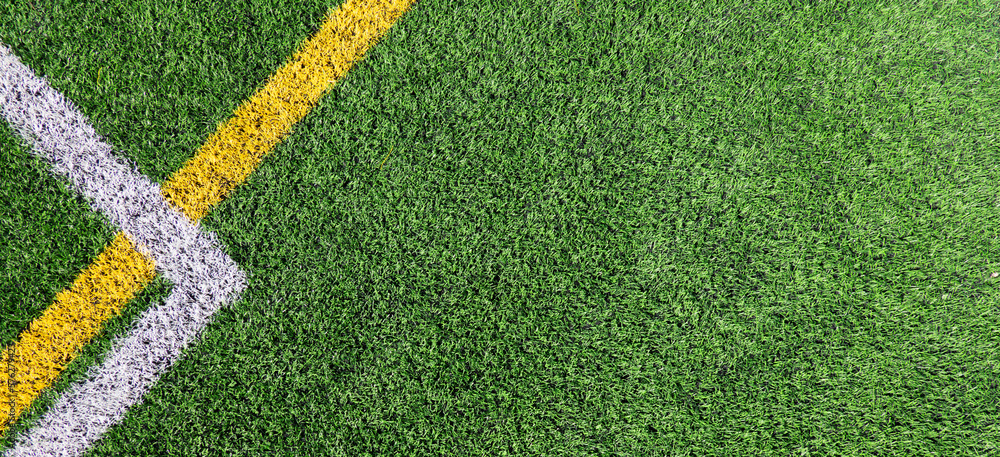 Green artificial grass turf soccer football field background with white ...