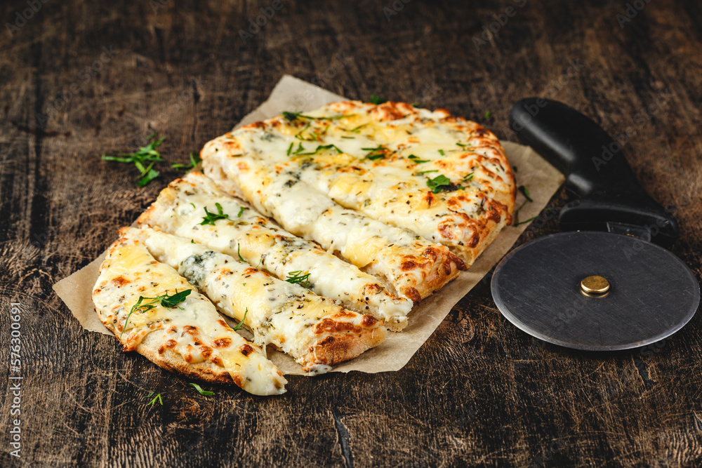 Roman-style pizzas with cheese. Roman square pizza or Pinsa on a thick ...