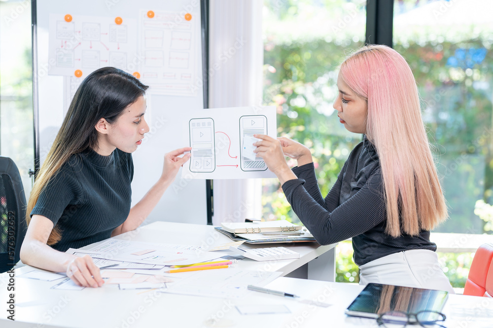 Foto de Two Young and beautiful creative female designer making a ...