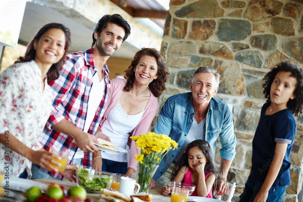 Ready to enjoy a family meal. A happy family enjoying a meal time ...
