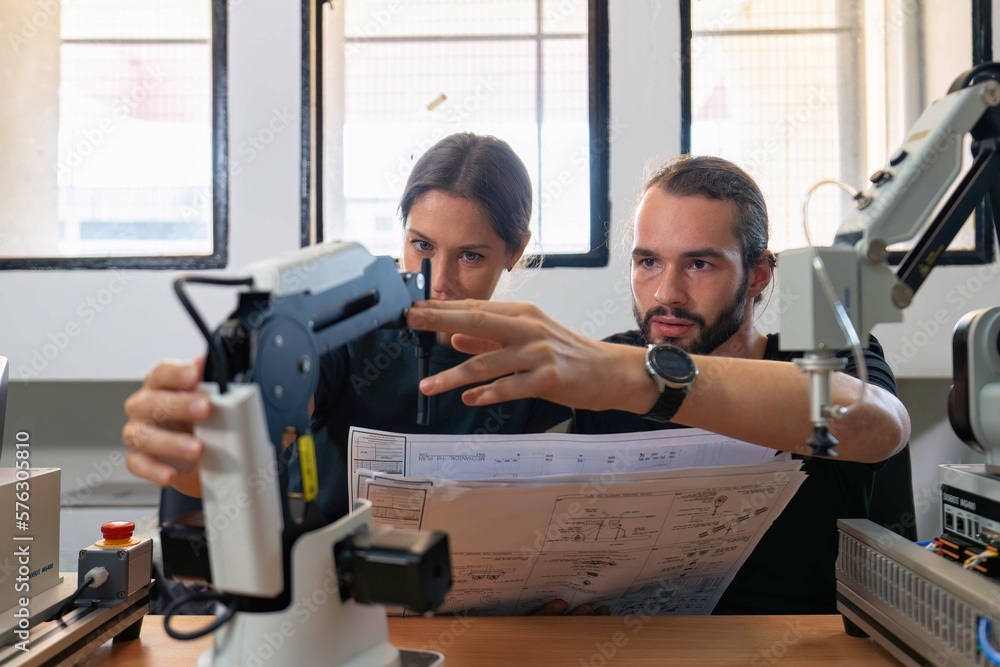 An engineer in research development robotic factory checking prototype ...