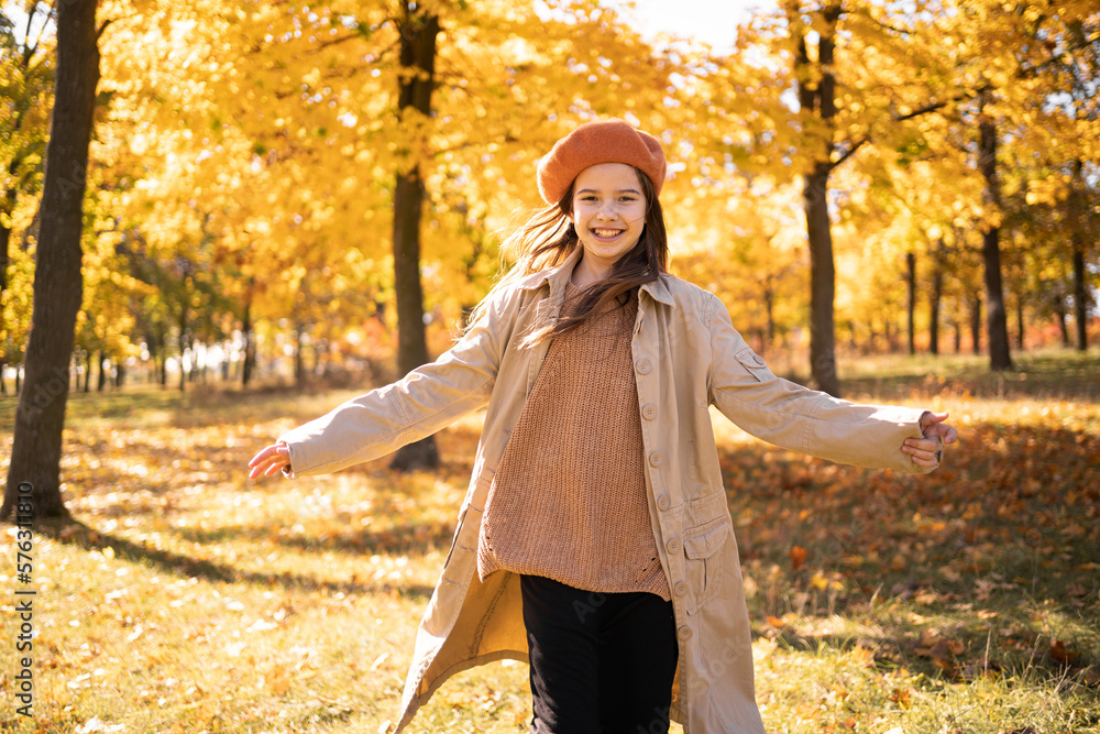 Beautiful teen girl relaxing at park during autumn season. Happy free ...