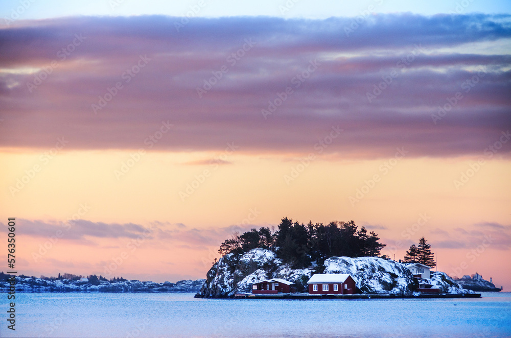 Small houses on snowy island with forest trees and hills Stock Photo ...