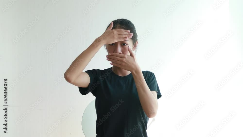 Young woman covering her face and eyes with her hands isolated, Cover ...