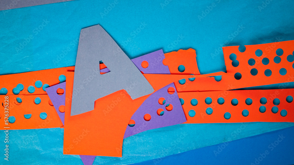 Foto de Letra A recortada en cartulina gris do Stock | Adobe Stock