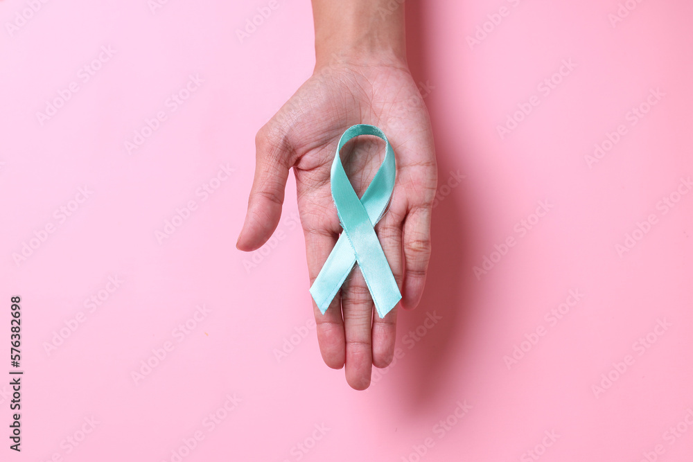 Teal awareness ribbon on hand for Ovarian Cancer month, cervical cancer ...