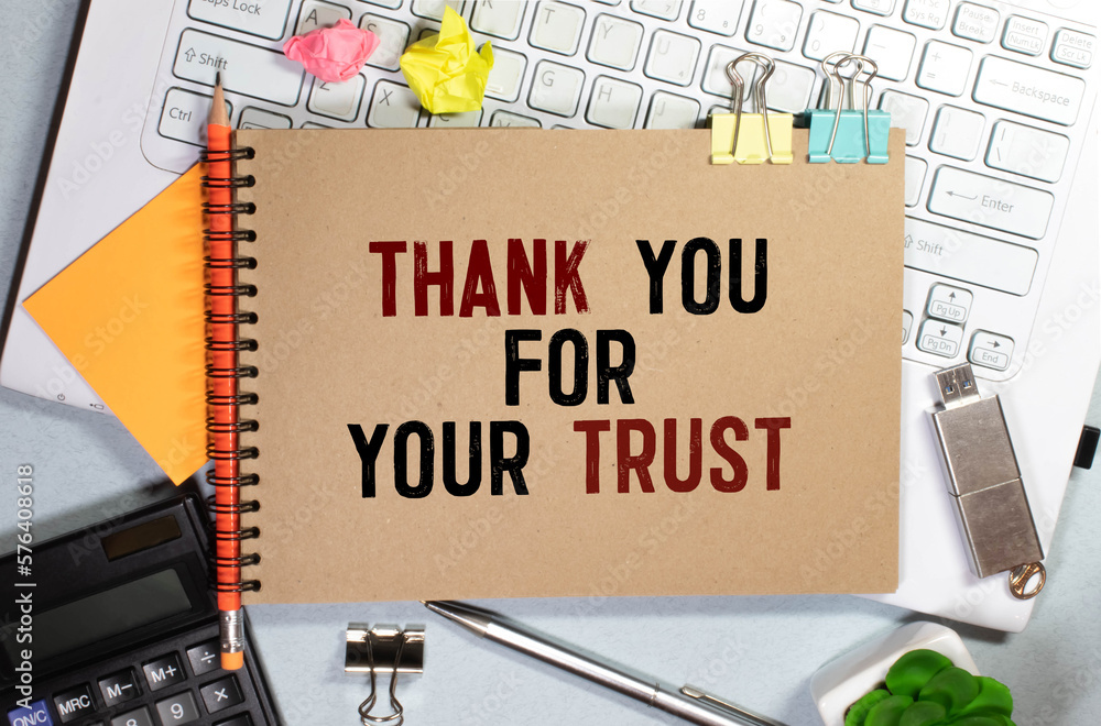 Thank you for your trust. text on white paper over torn paper ...