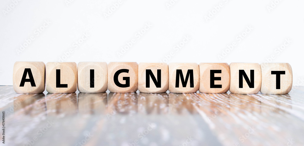 Alignment. Cubes form the word Alignment. Broad concept from business ...