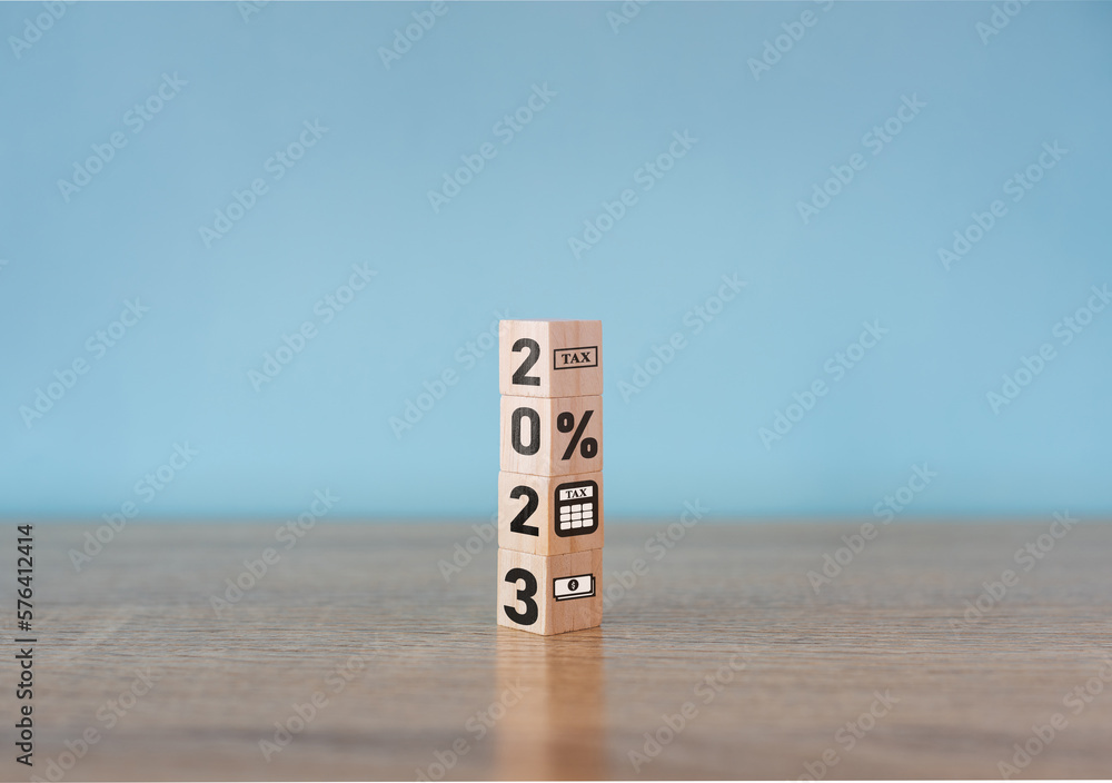 Tax and 2023 number on wooden block. Pay tax in 2023 years. The new ...
