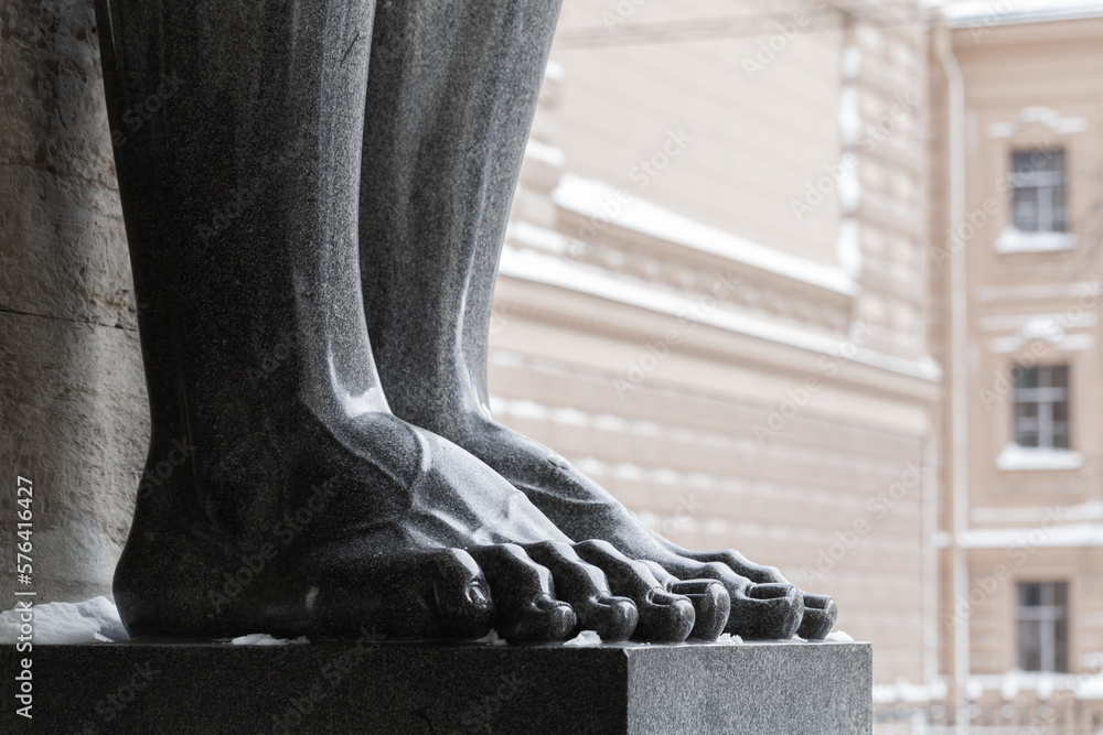 Feet of black granite Atlas statue. Classic architecture Stock Photo ...