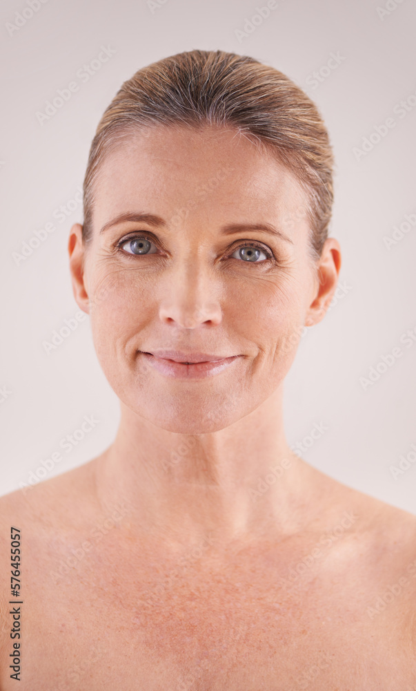 Maturing beauty. Cropped portrait of a beautiful mature woman posing in ...