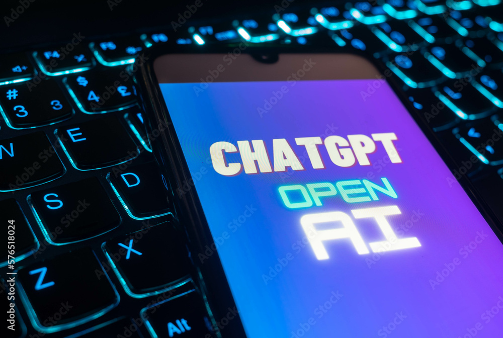 Chatgpt logo seen on smartphone screen on top of a computer keyboard ...